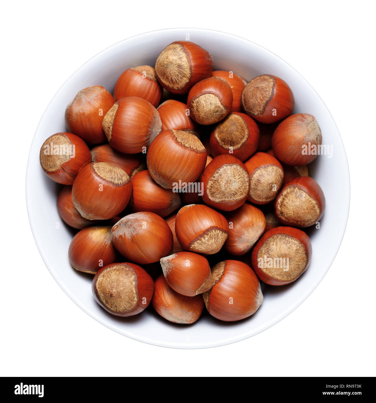 Hazelnuts with shell in bowl isolated on white background Stock Photo ...