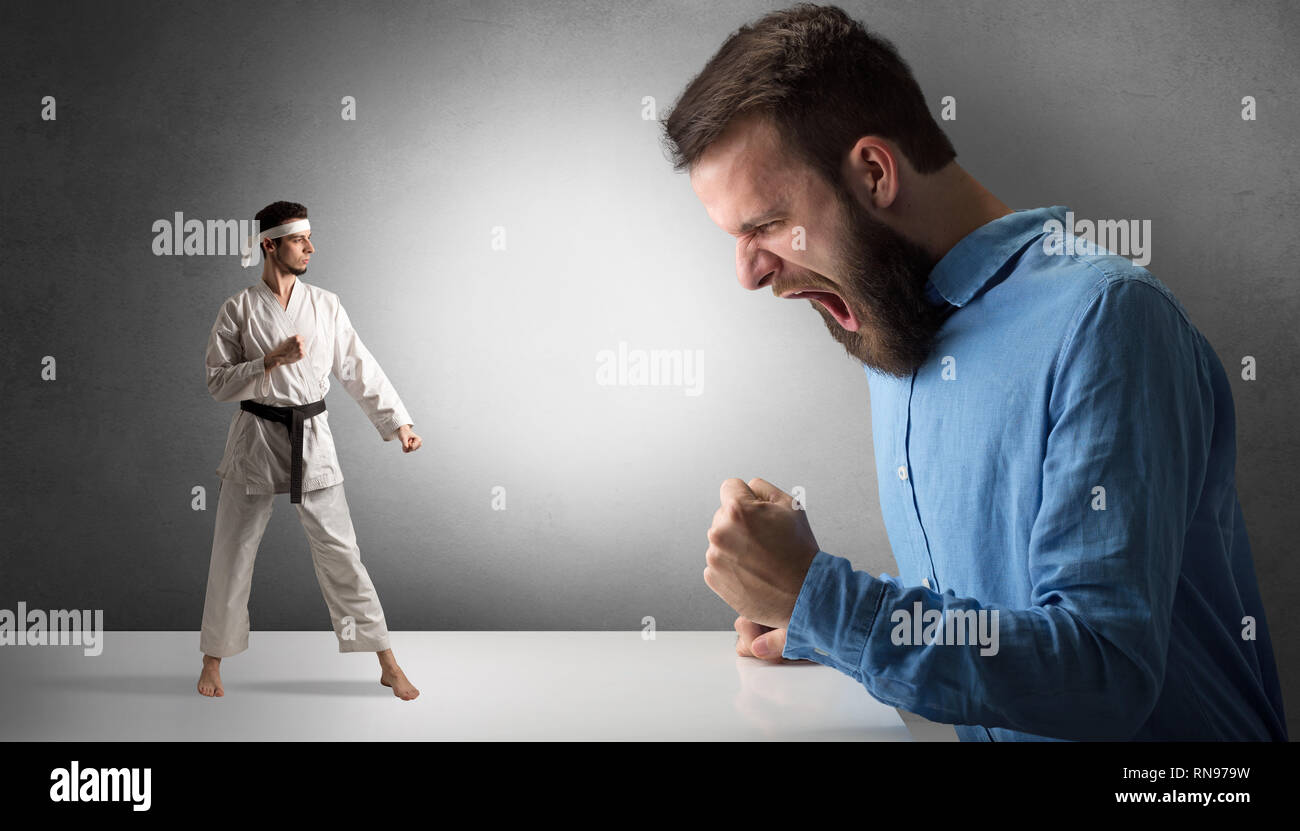 Giant hipster man yelling at a small karate man Stock Photo - Alamy