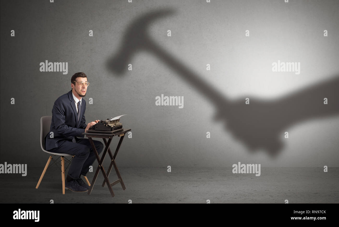 Shadow threatening hard worker man who is afraid Stock Photo - Alamy