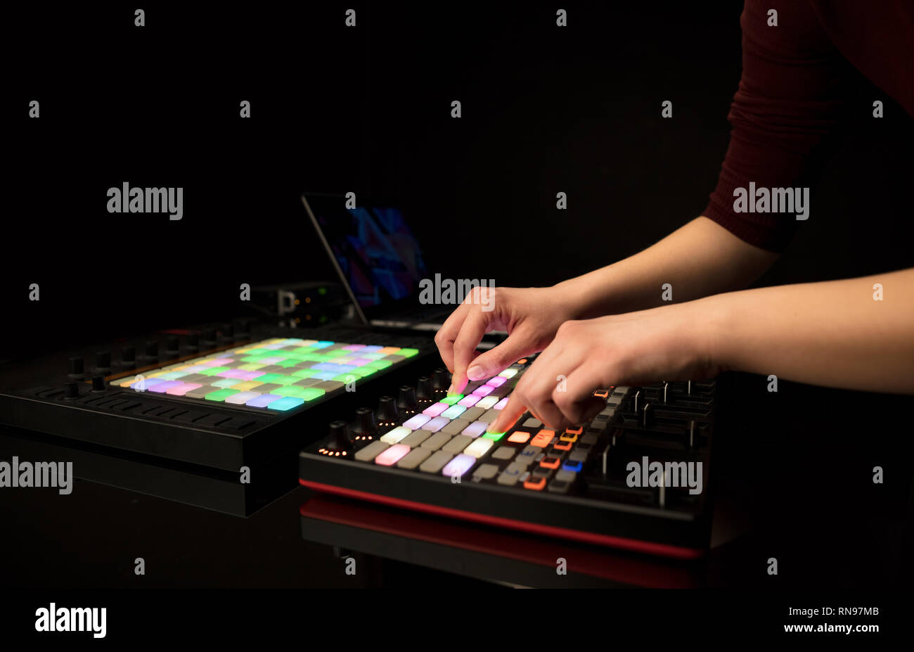 Dj hand remixing music on midi controller Stock Photo - Alamy