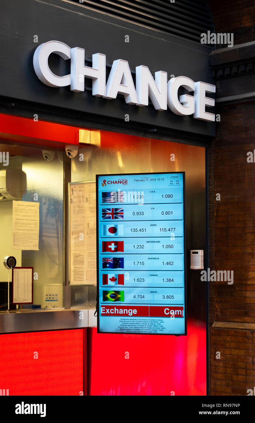 Currency exchange shop in Seville, Spain Stock Photo - Alamy