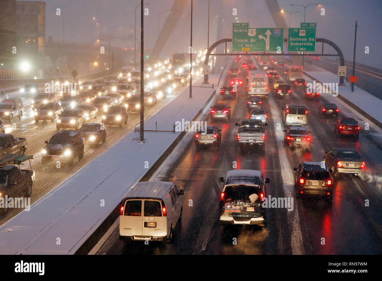 Rush hour traffic in a snow storm over the Zakim Bridge, I-93, Boston ...
