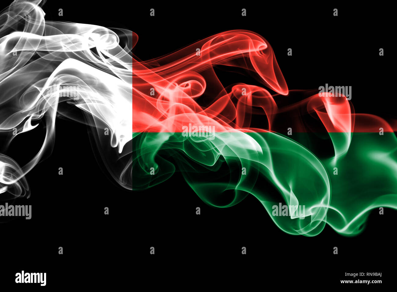 National flag of Madagascar made from colored smoke isolated on black ...