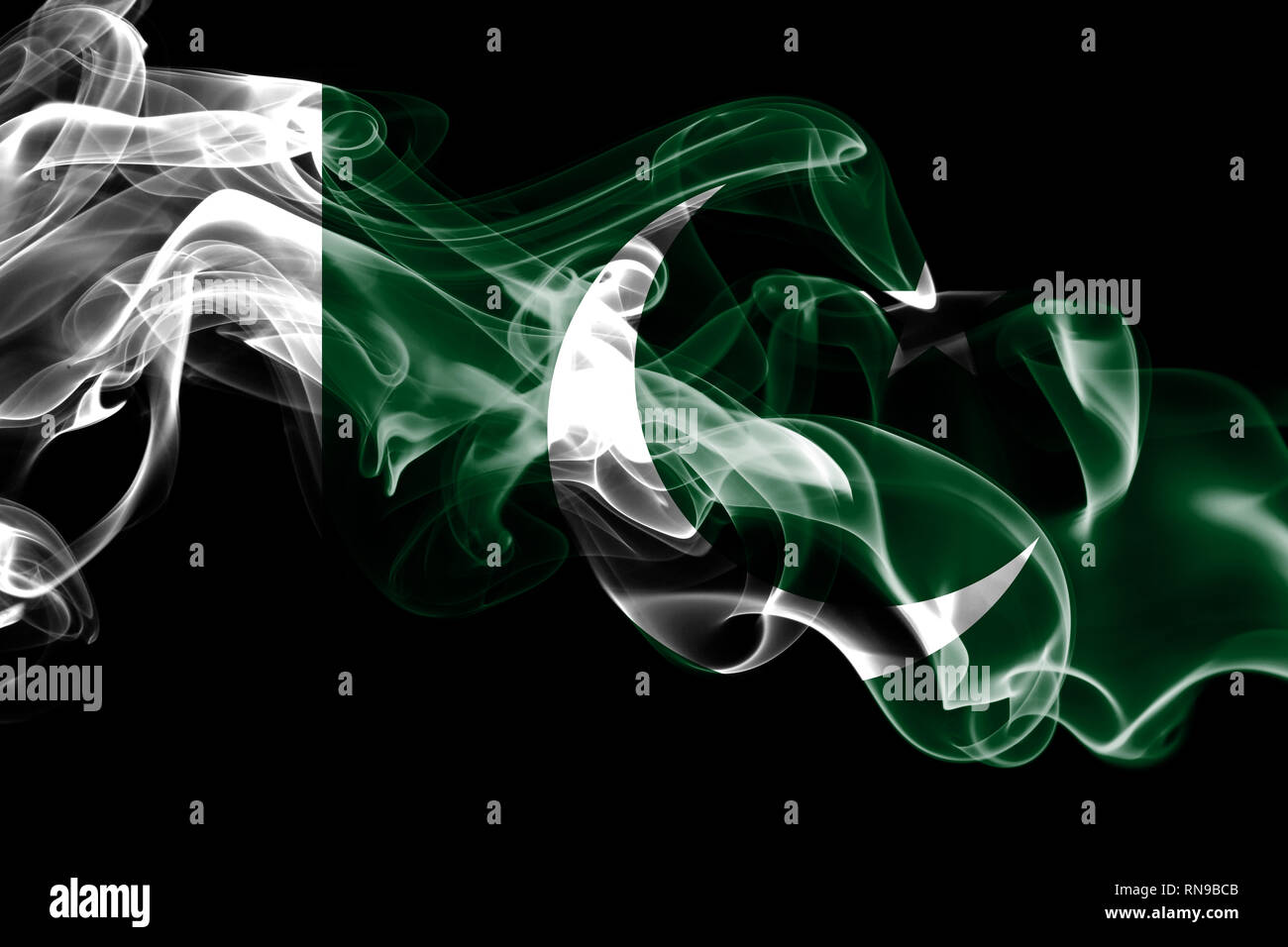 National flag of Pakistan made from colored smoke isolated on black ...