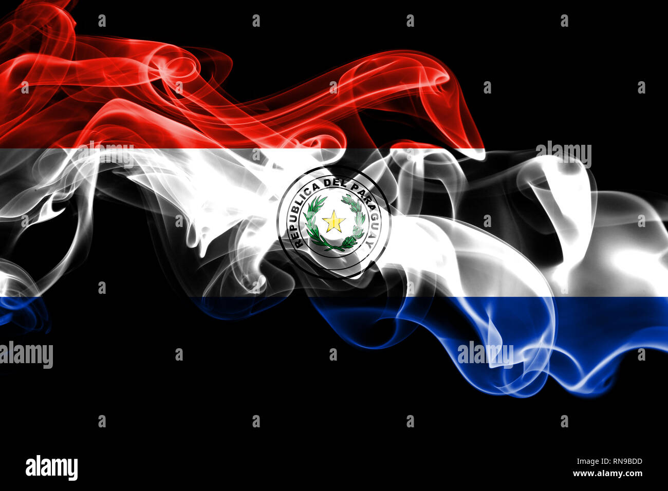 National flag of Paraguay made from colored smoke isolated on black ...