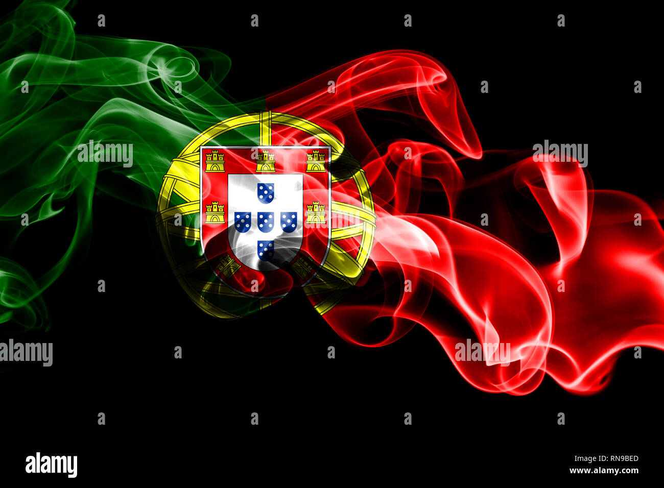 National flag of Portugal made from colored smoke isolated on black ...