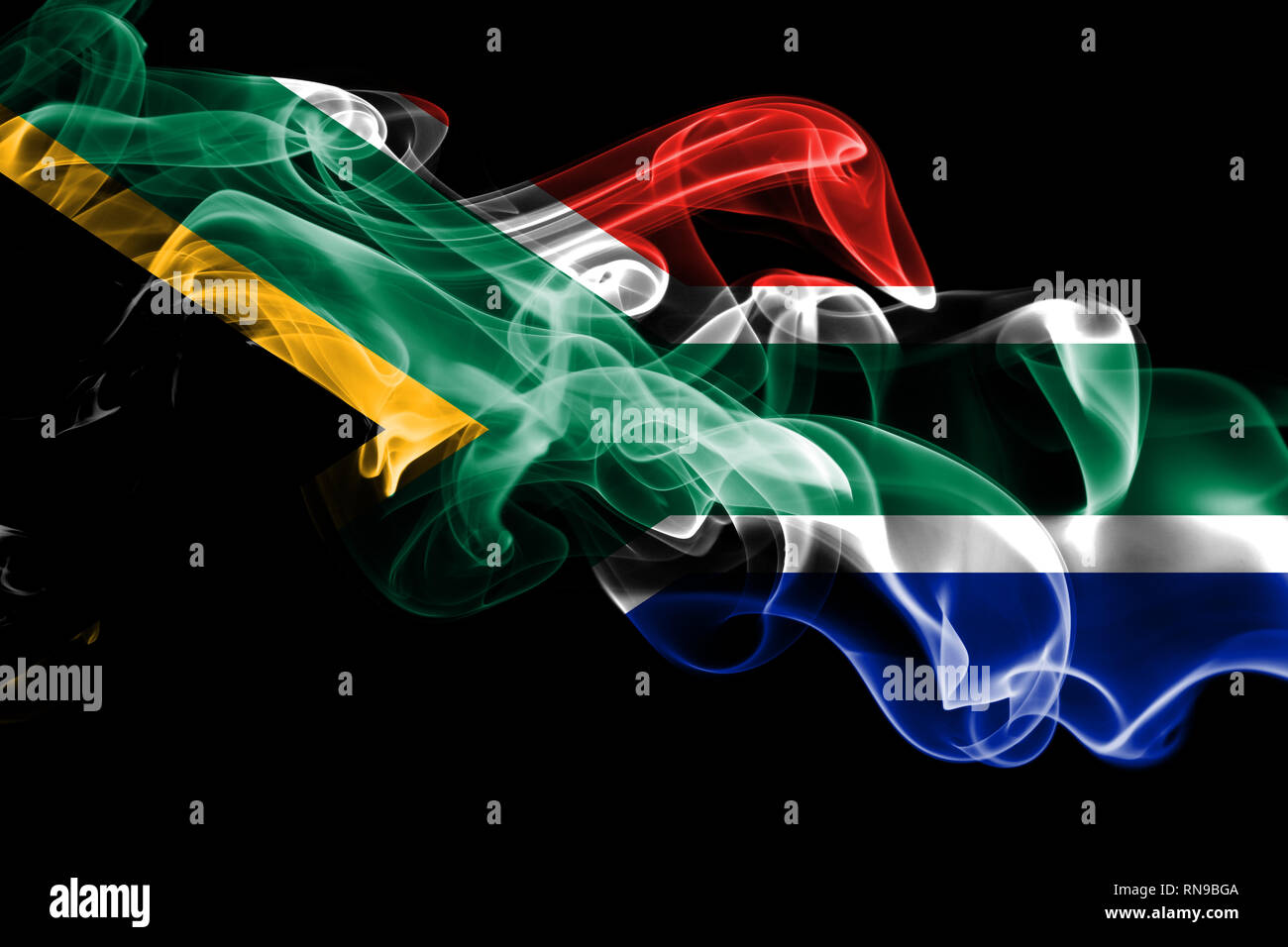 National flag of South Africa made from colored smoke isolated on black ...