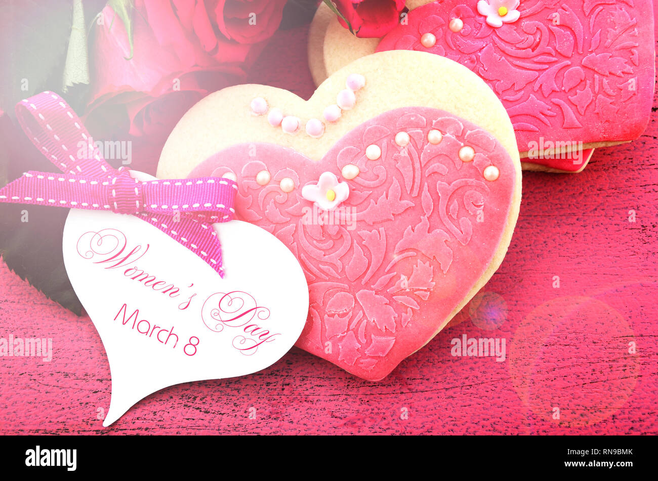 International Women's Day heart shape cookies decorated as pink ladies ...