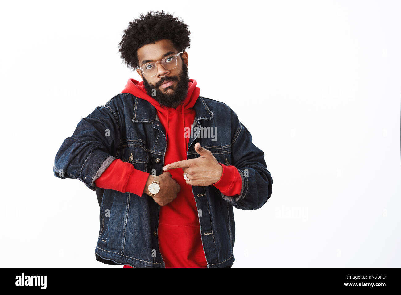 Bothered friend pointing at watch as mate late, tilting head ...