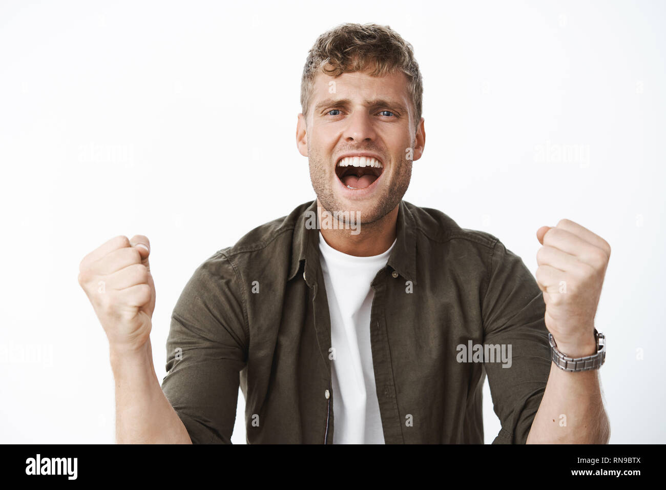 Guy cheering with excitement and joy yelling at camera supportive words ...