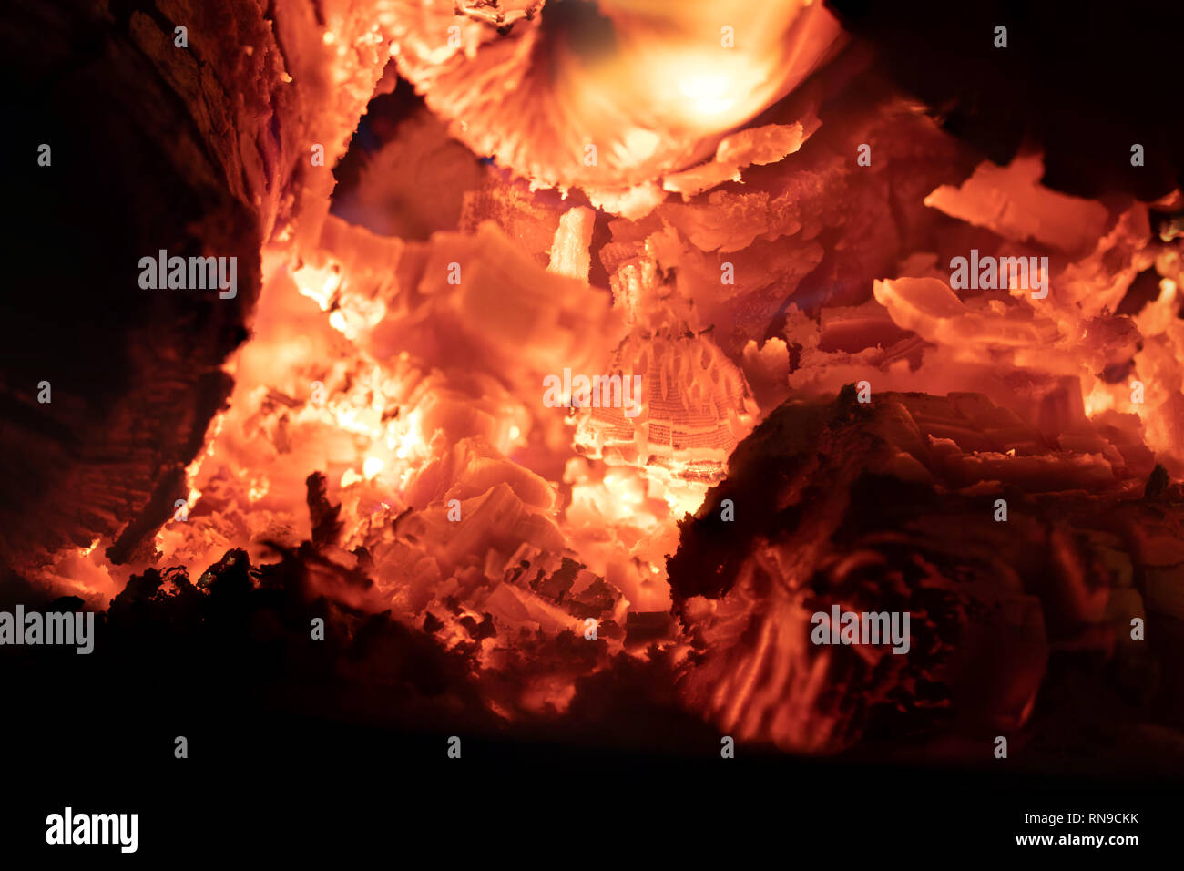 Enjoying the radiant heat from a beautiful fire Stock Photo - Alamy