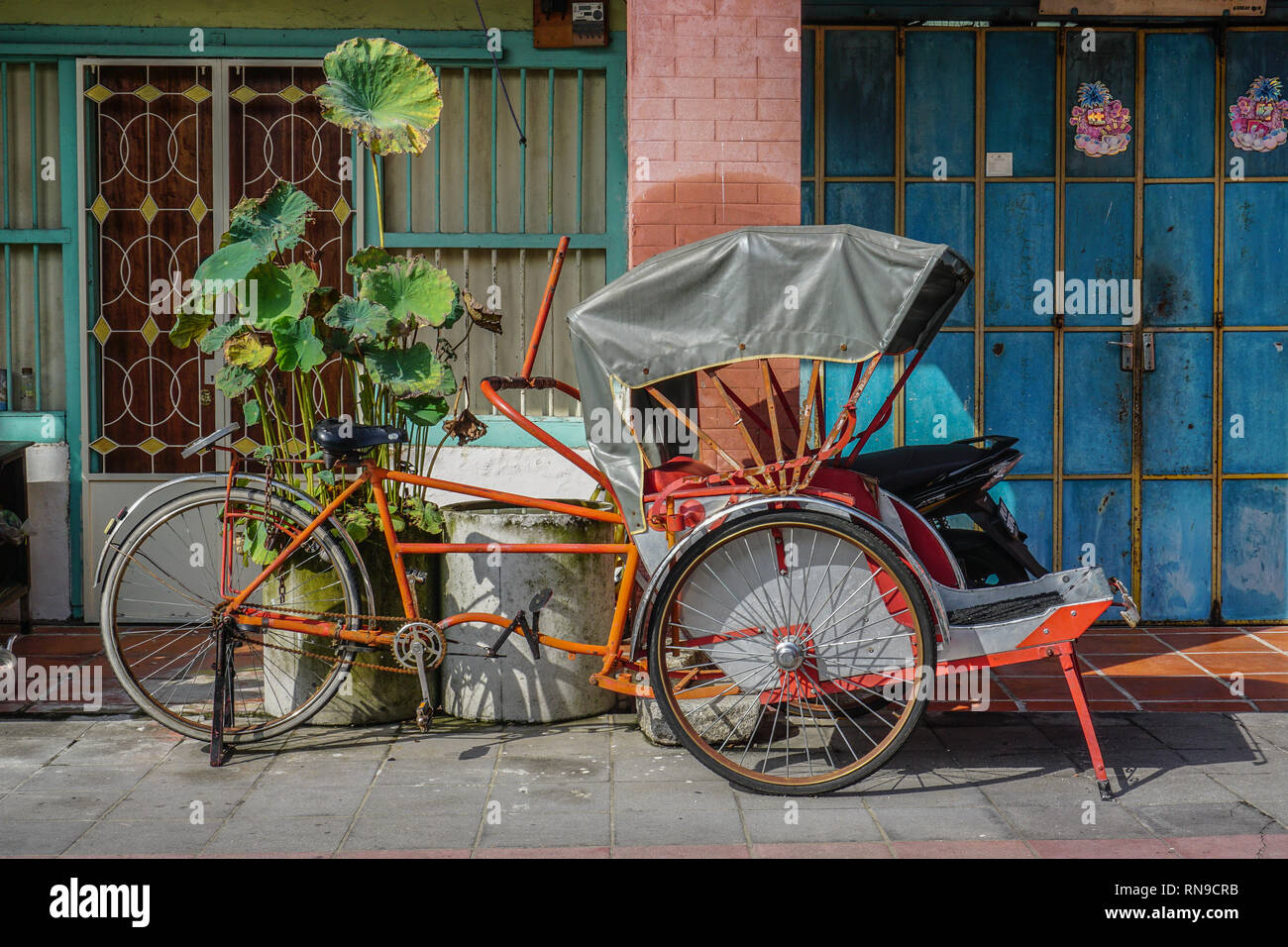 Rickshaw tricycle at the street of the George Town, Penang, Malaysia ...