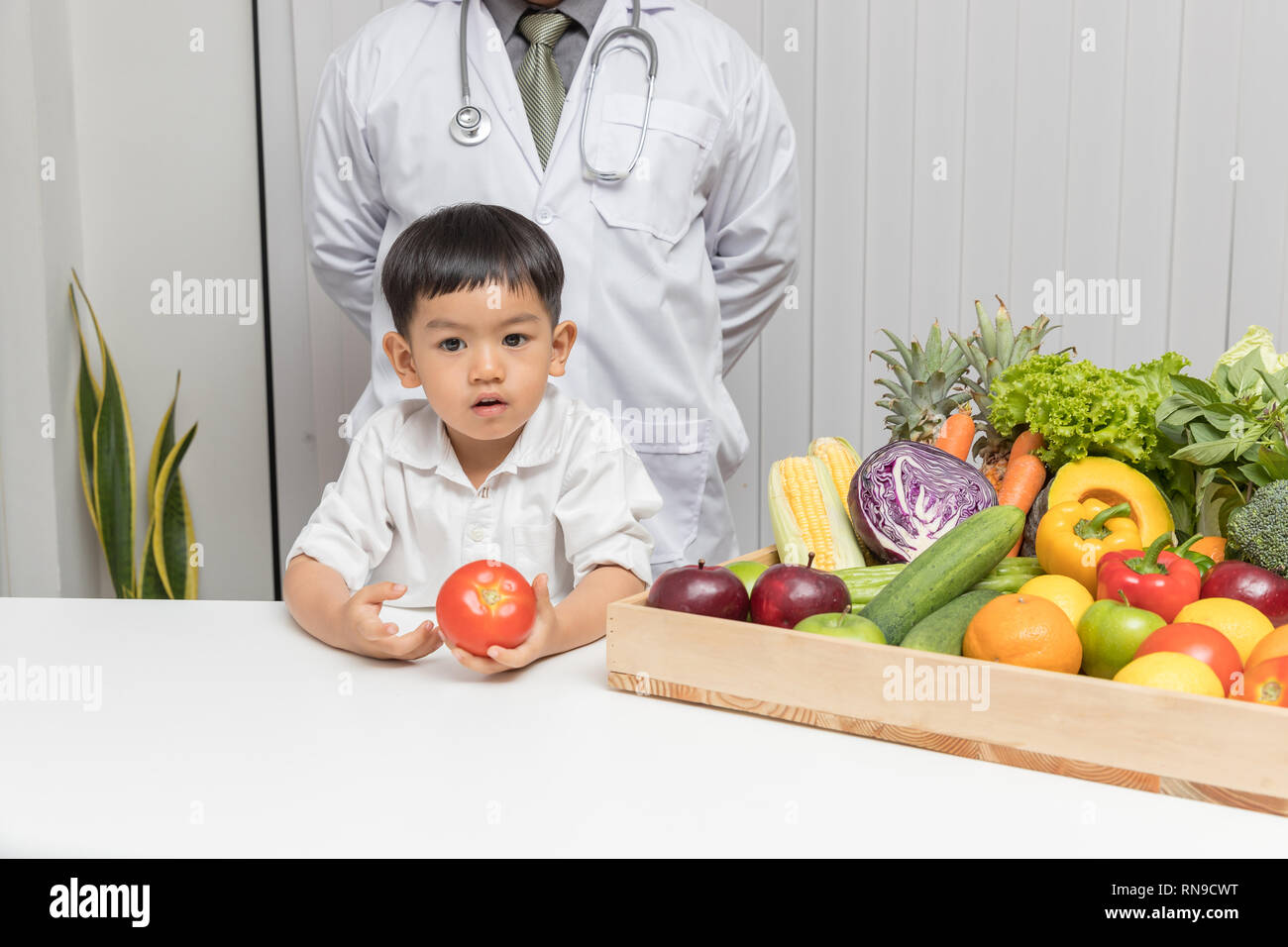 Healthy and nutrition concept. Kid learning about nutrition with doctor ...