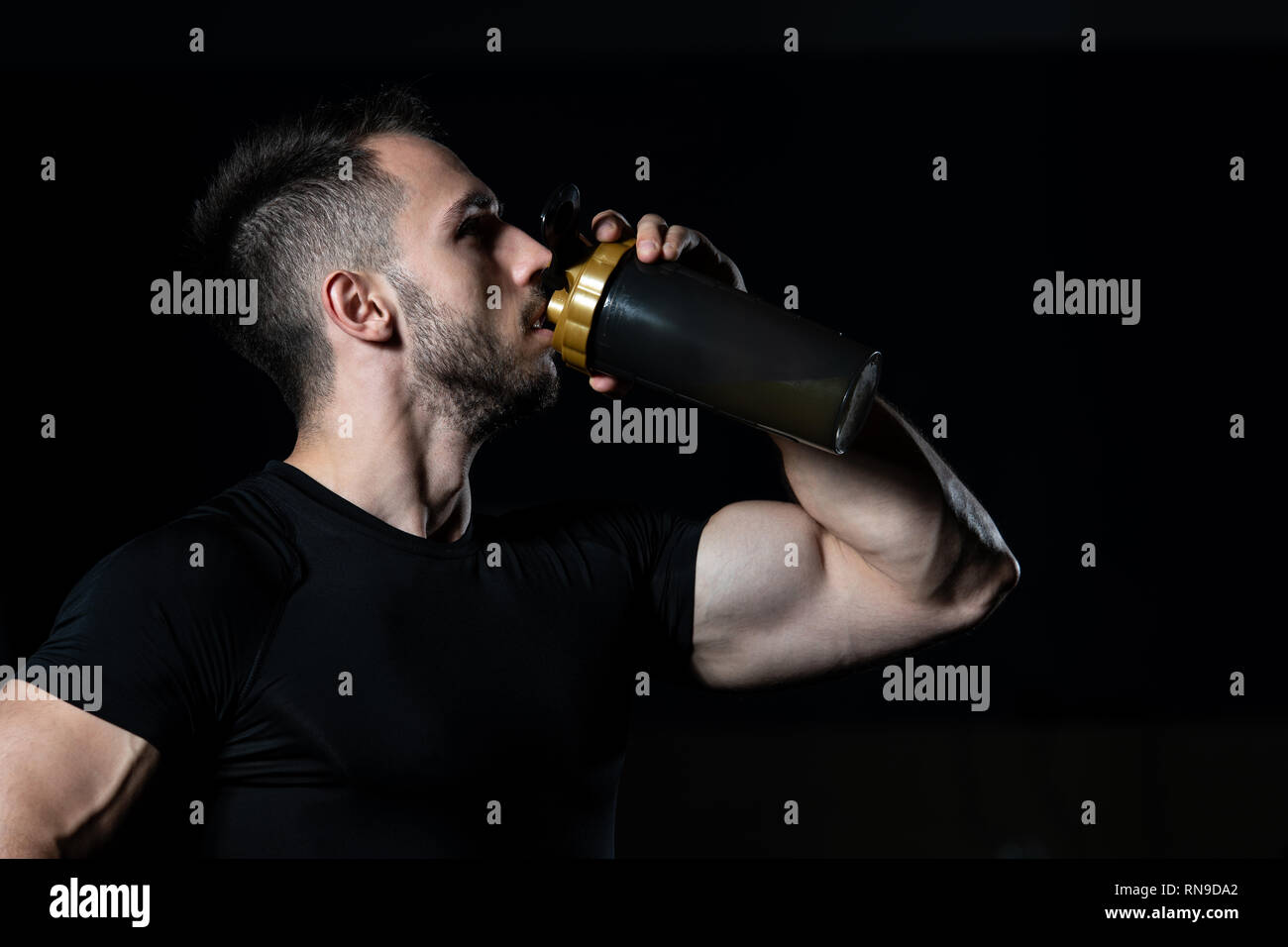 Muscular Man Resting After Exercise And Drinking From Shaker Stock ...