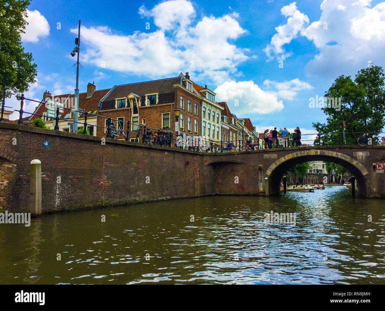 Amazing view of beautiful buildings, bicycles, a bridge with group of ...