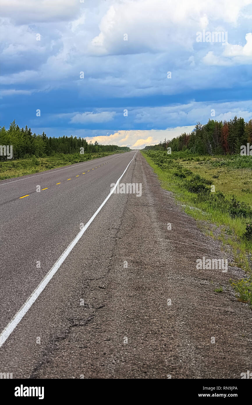 The long view of a highway with a storm brewing in the distance Stock ...