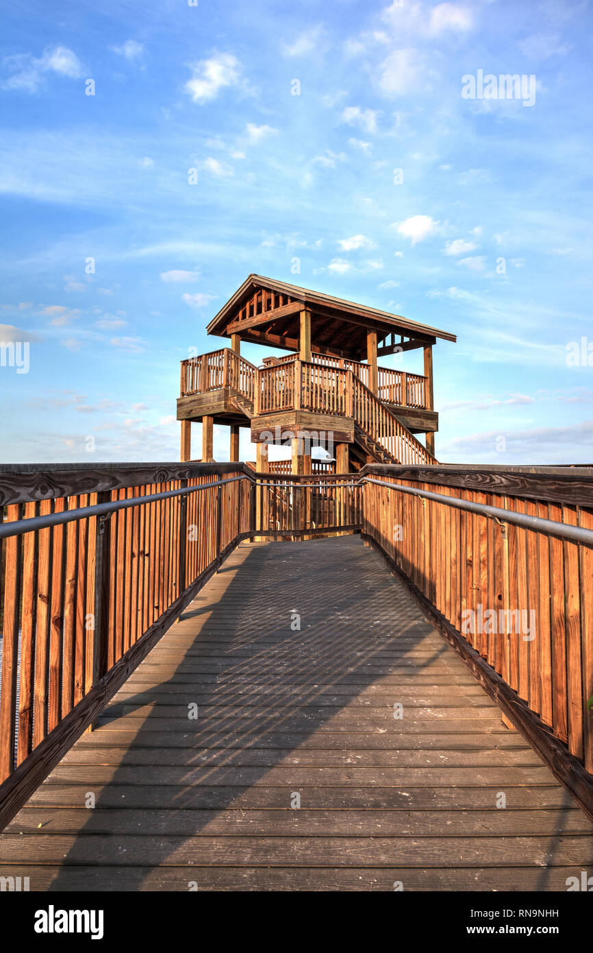 Bird observation tower at the end of a boardwalk at sunrise on ...