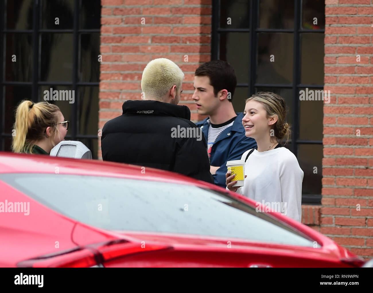 Genevieve "G" Hannelius gets a hot drink and chats with friends after a ...