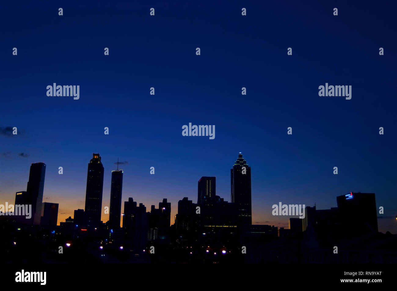 A dramatic sunset over several modern high-rise buildings in Atlanta ...