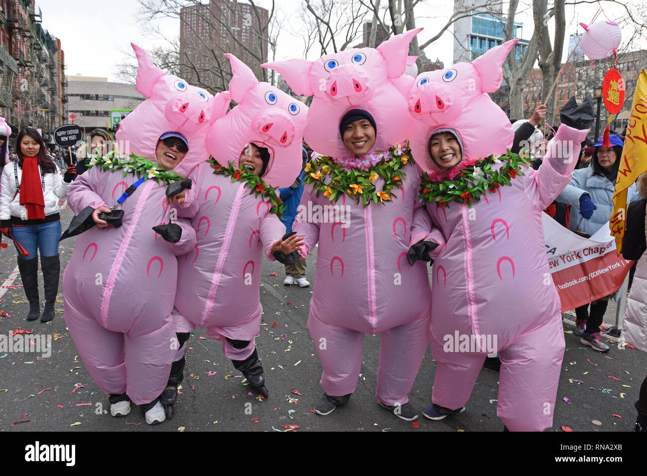 New York, USA. 17th Feb, 2019. Revellers in the parade in Pink Pig ...