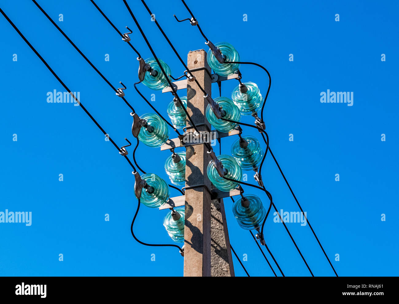 Concrete pole with electrical wires and high-voltage distribution ...