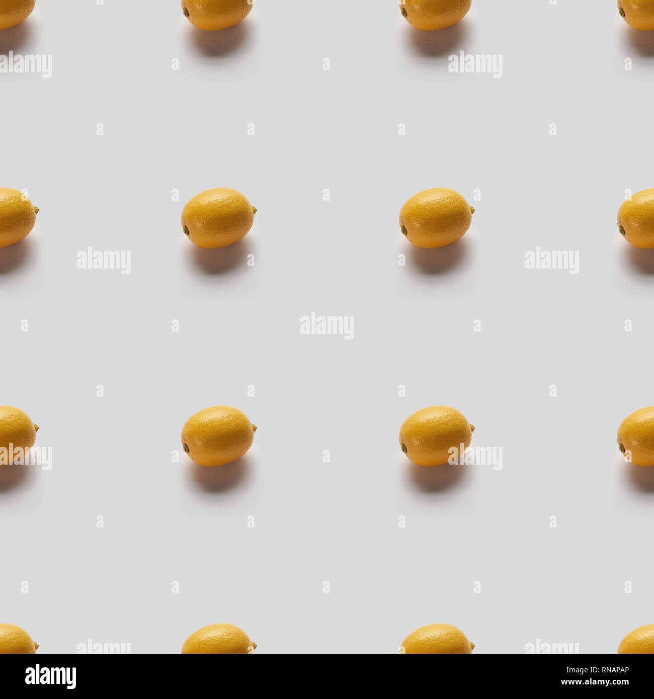 yellow whole lemons on grey background, seamless pattern Stock Photo ...