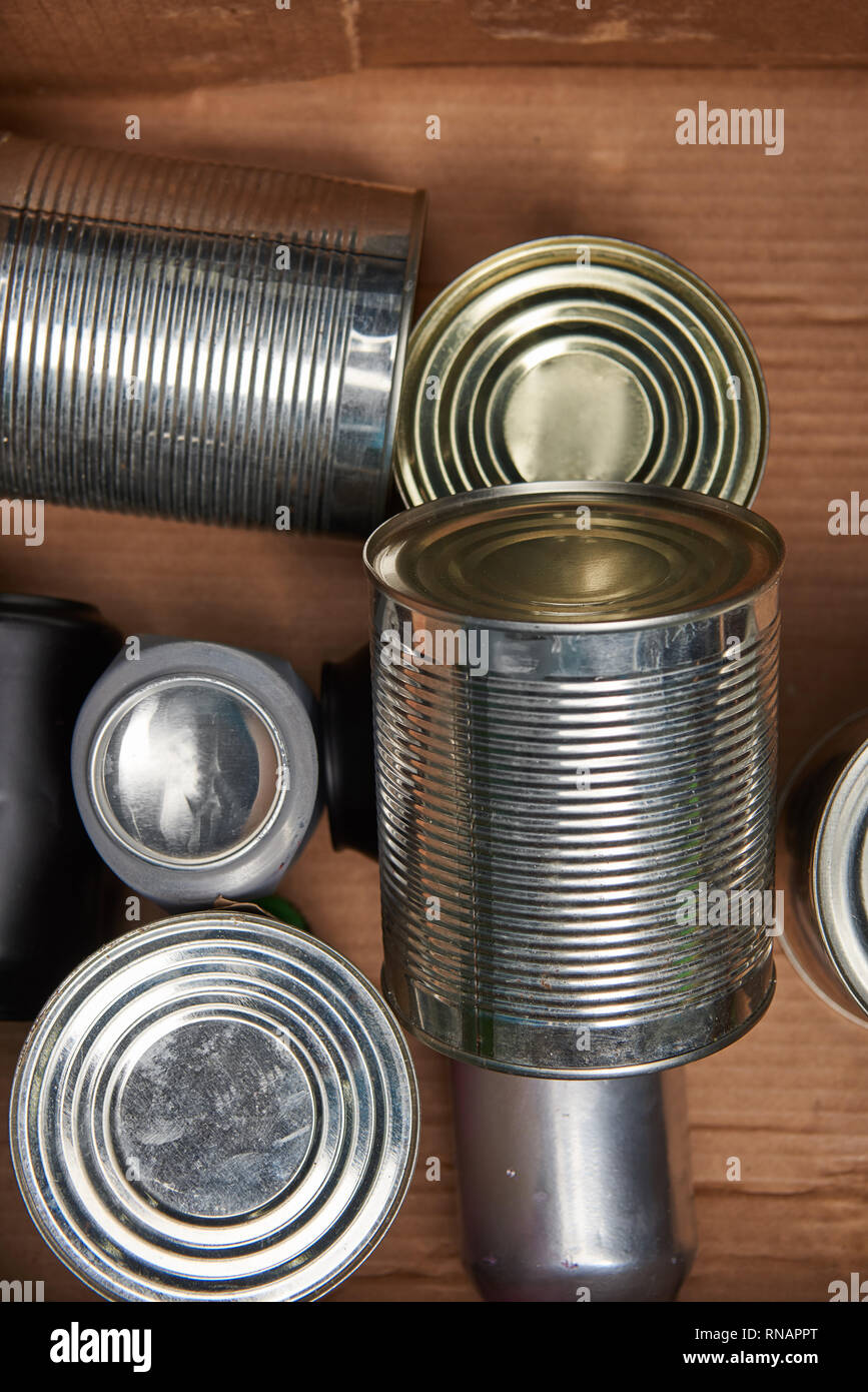 different iron silver cans in cardboard box Stock Photo - Alamy
