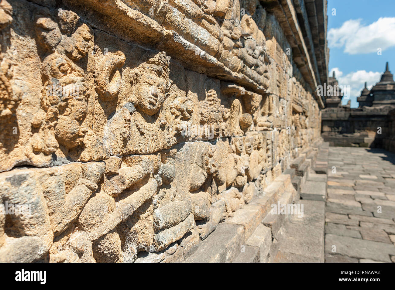 walls of stone with hindu's motif carving at Borobudur Temple in Java ...
