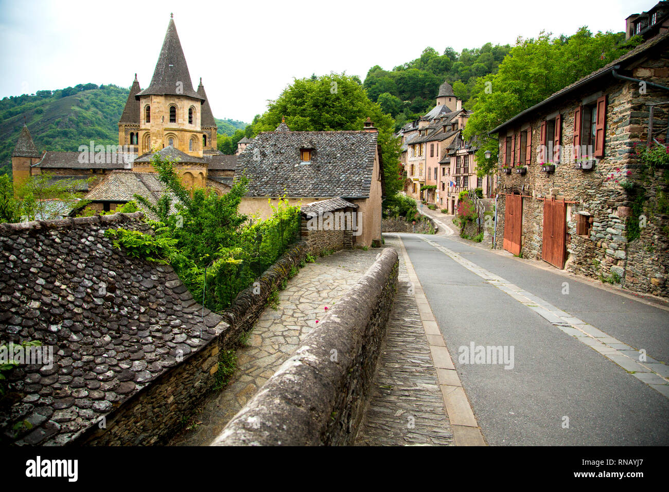 The medieval village of Conques in France. For centuries pilgrims have ...