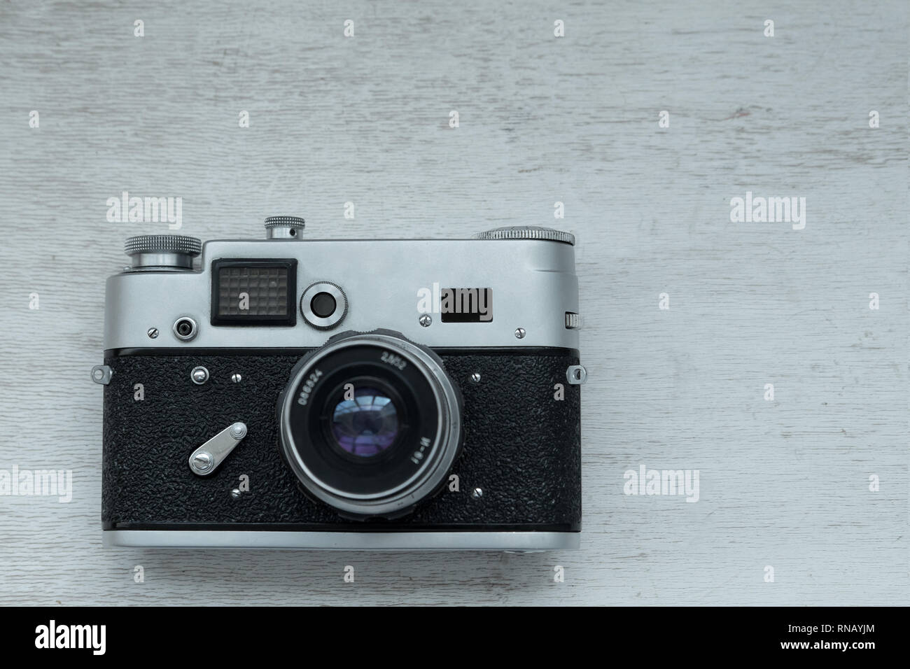 Old film camera on a gray background, selective focus Stock Photo - Alamy