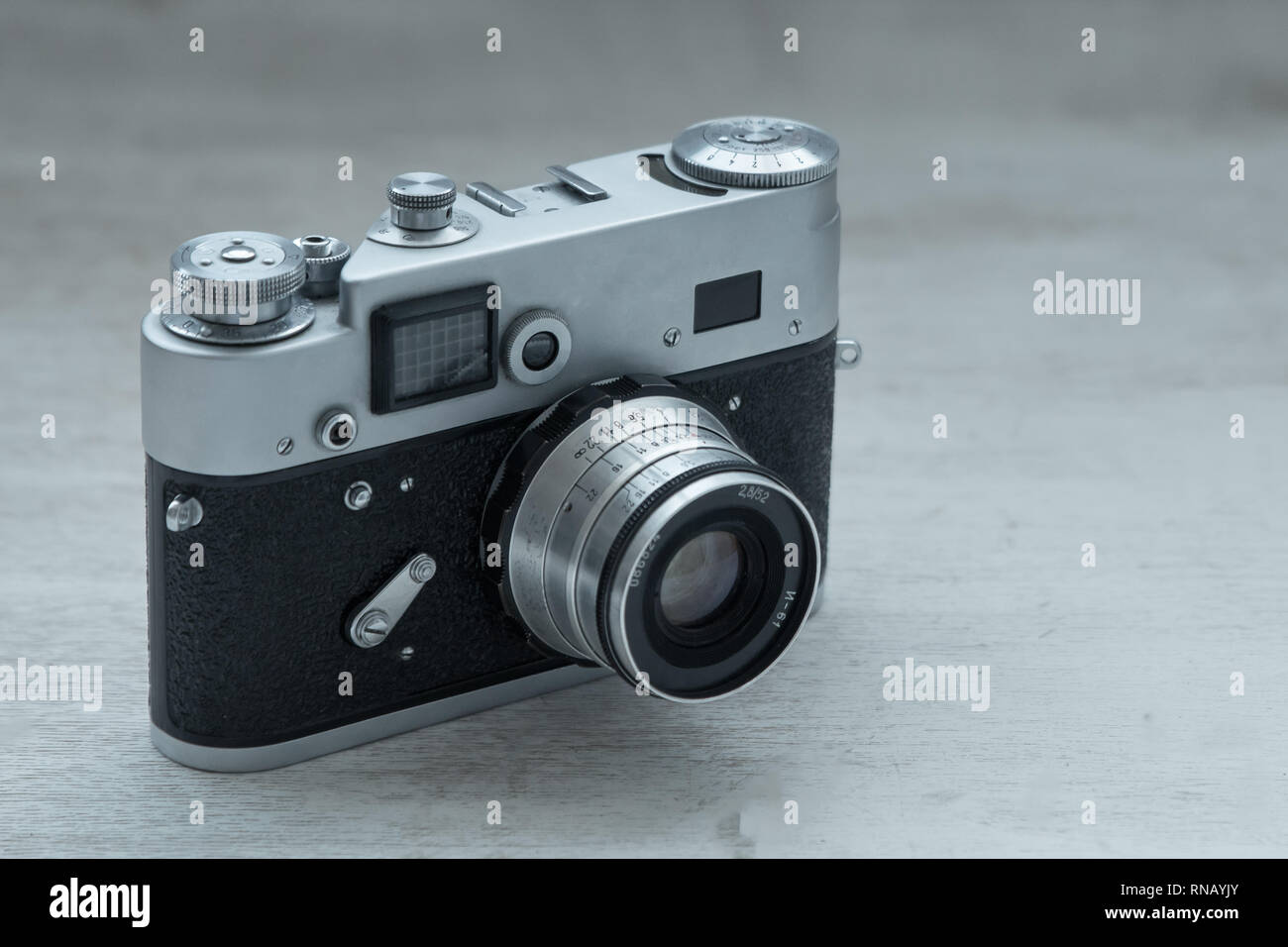 Old film camera on a gray background, selective focus Stock Photo - Alamy