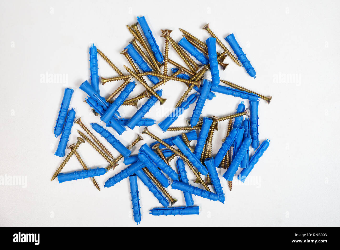 Plastic dowel pin or wall plugs on white background Stock Photo - Alamy