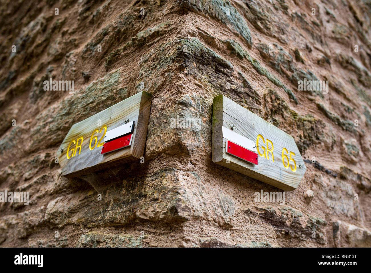 Signs giving directions for GR62 and GR65 in Conques France Stock Photo ...