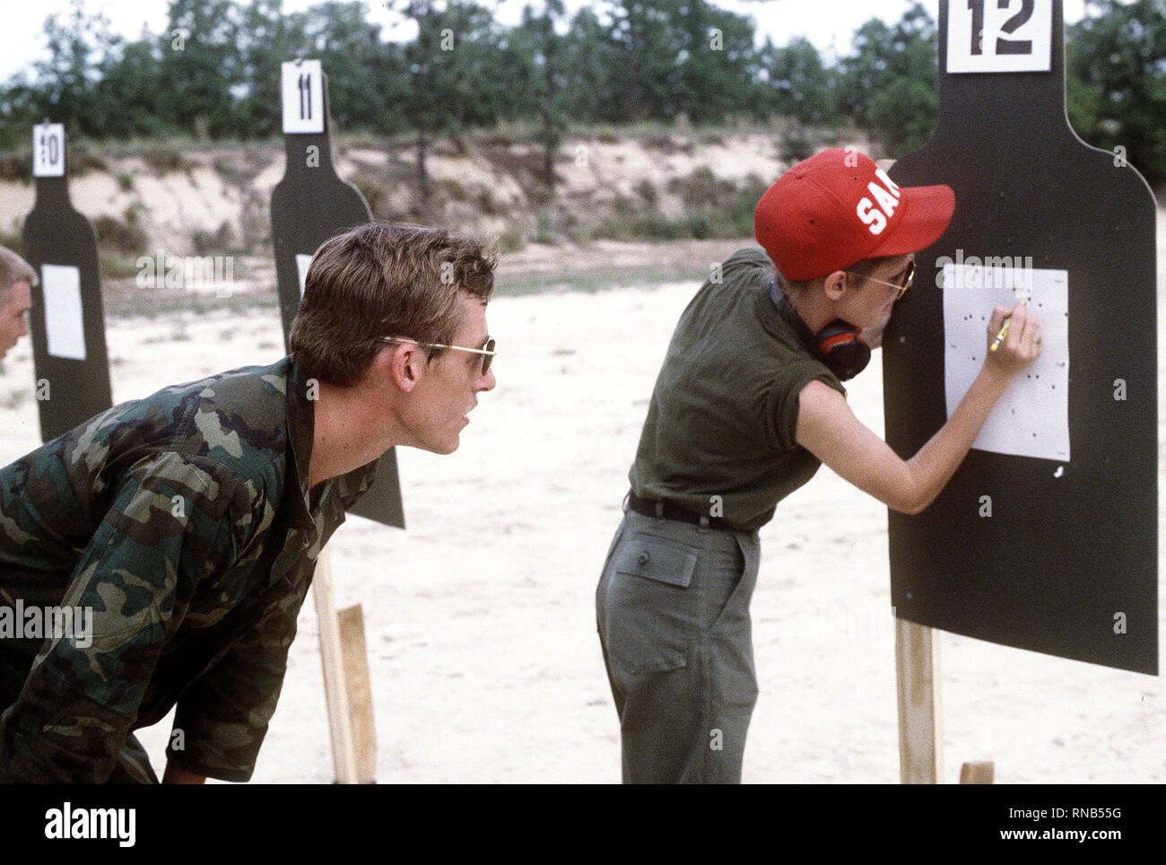 A Royal Canadian Air Force member watches the judge check his target ...