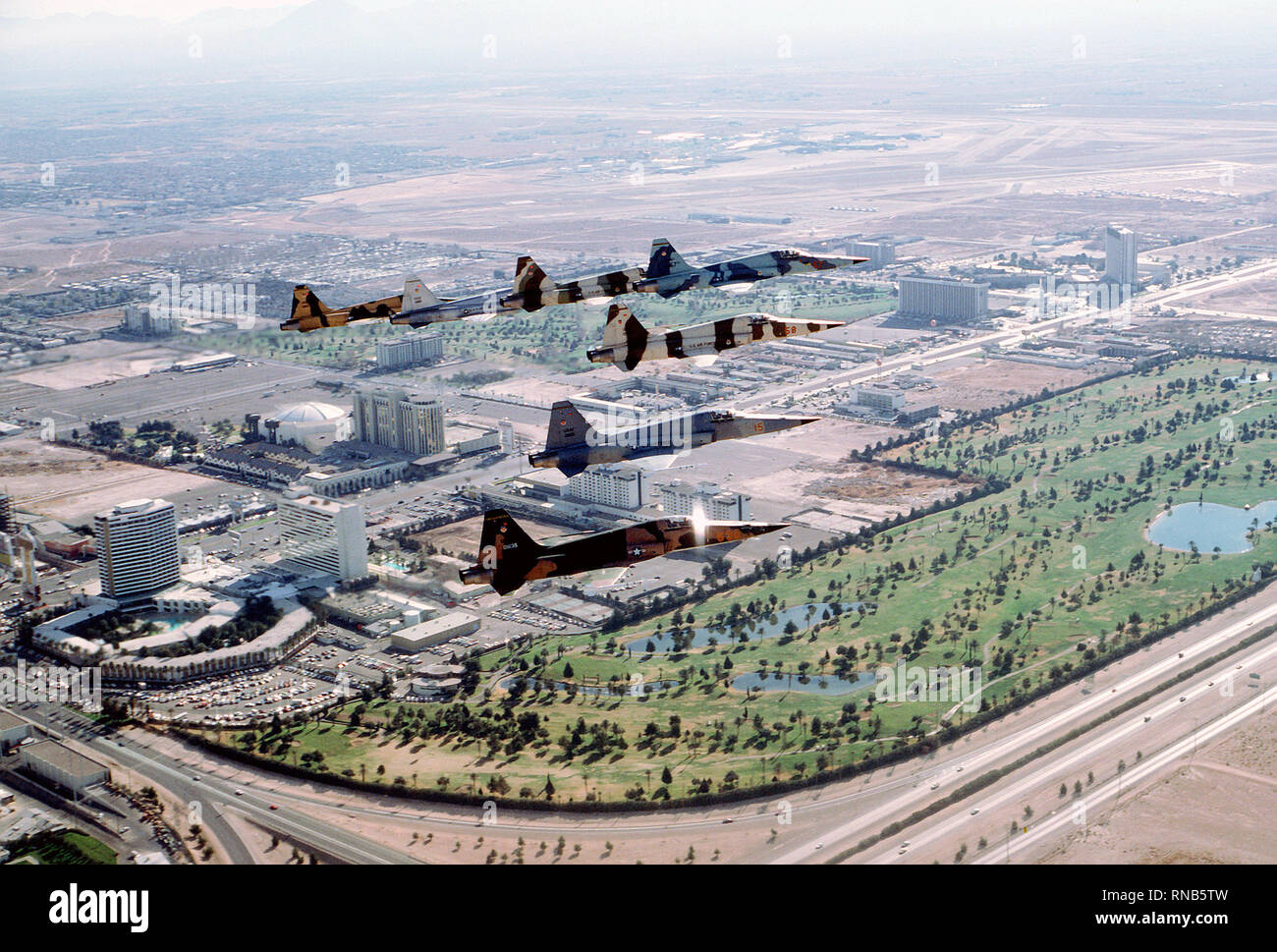 An air-to-air right side view of a seven-ship wedge formation of F-5E ...