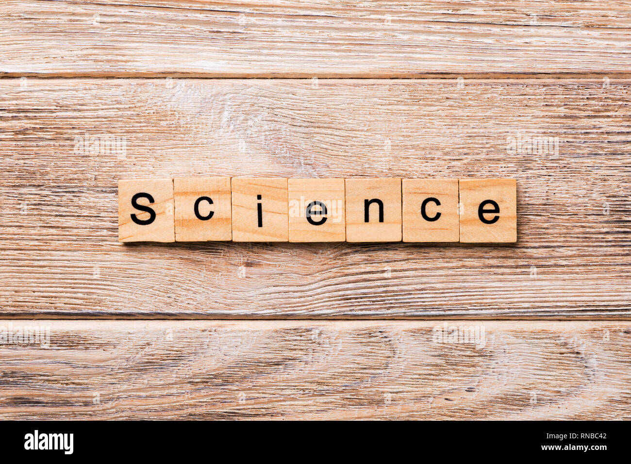 science word written on wood block. science text on wooden table for ...