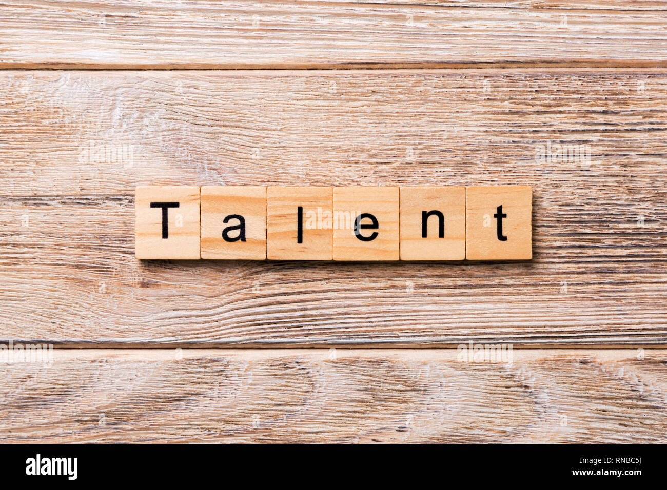 Talent word written on wood block. Talent text on wooden table for your ...