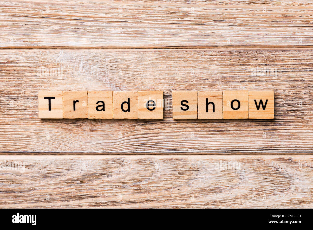 Trade Show word written on wood block. Trade Show text on wooden table ...