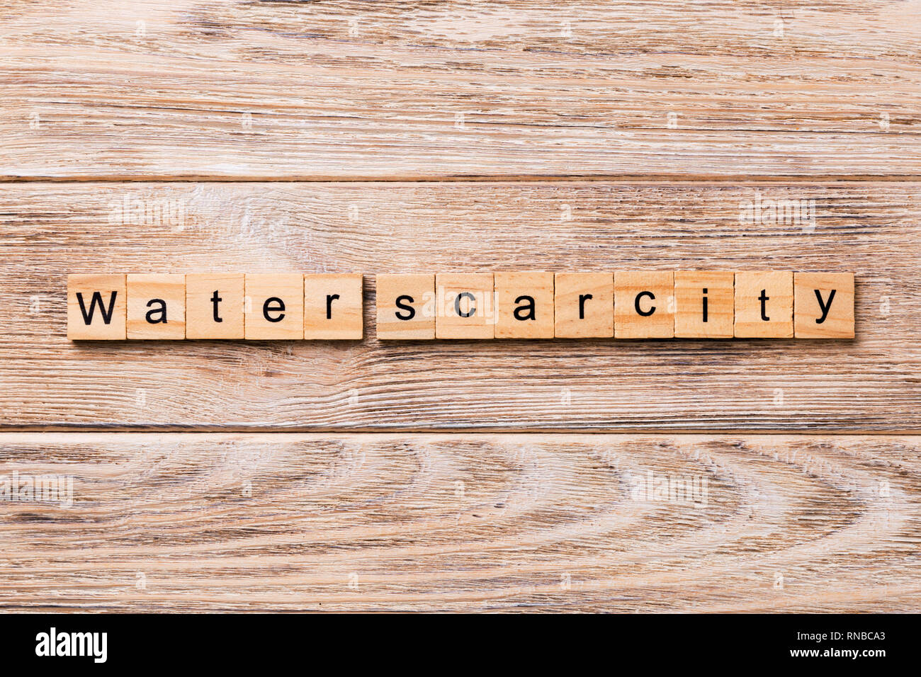 Water scarcity word written on wood block. Water scarcity text on ...