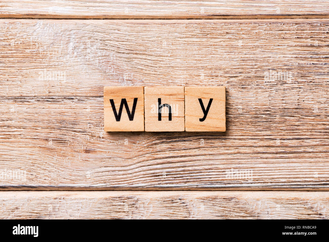 WHY word written on wood block. WHY text on wooden table for your ...