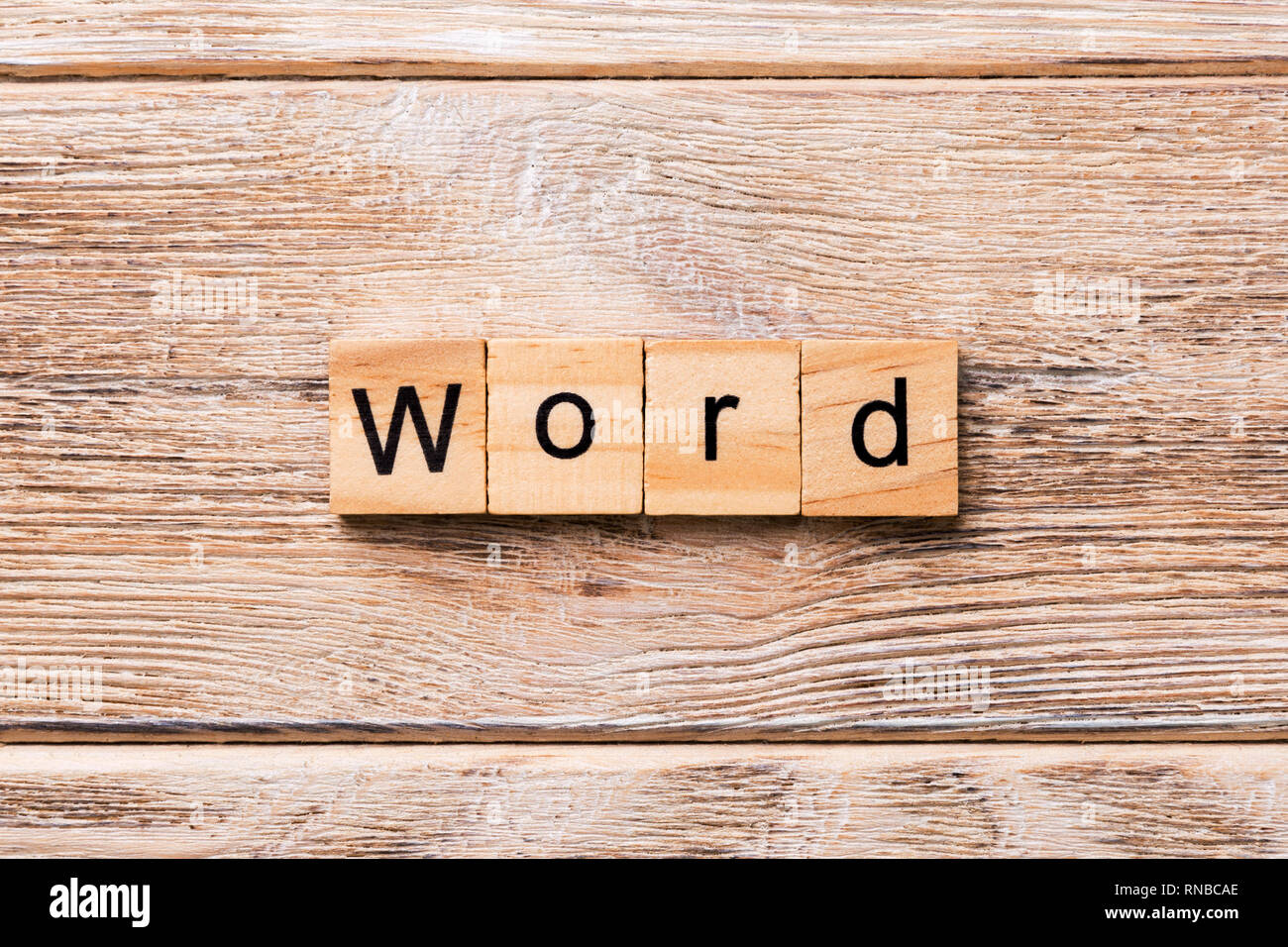 word written on wood block. WORD text on wooden table for your desing ...