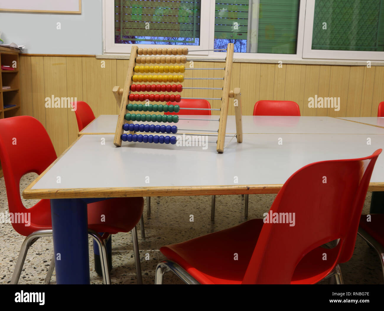 interior of a school classroom with wooden abacus above the table to ...