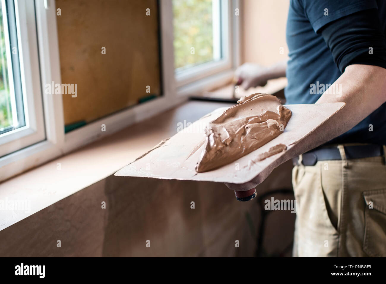 Close Up Of Plasterer Plastering Room Of House Stock Photo - Alamy