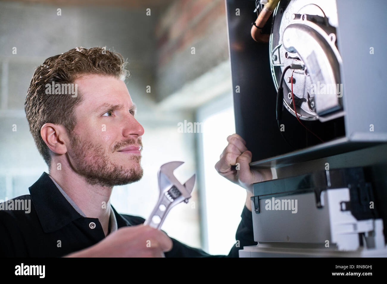 Installing boiler hi-res stock photography and images - Alamy