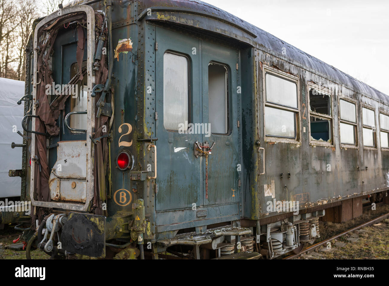 Derelict and decayed train wagon on abandoned railway station in ...