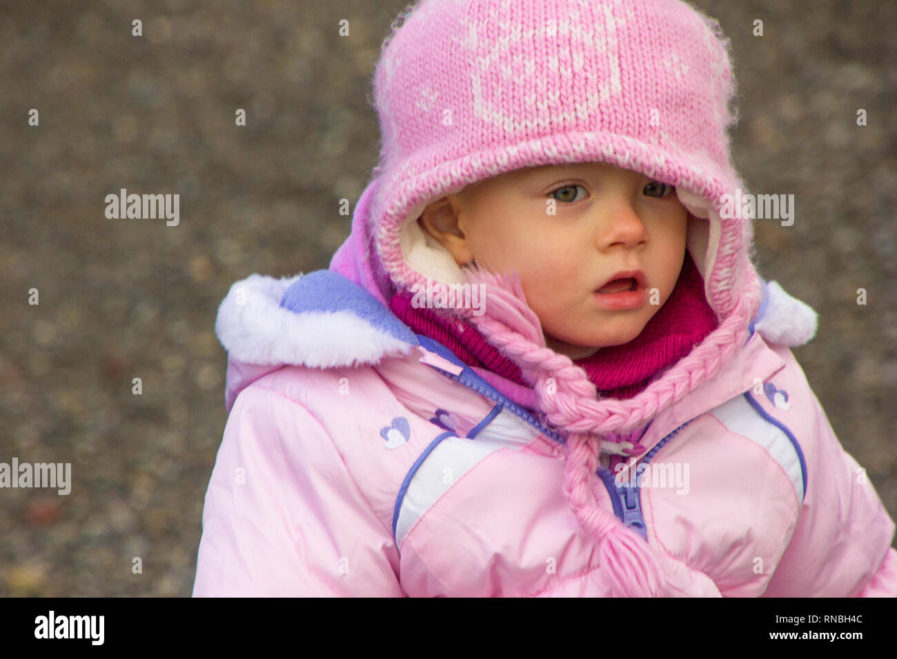 20 months old baby enjoying the nice weather outside. Toddler girl ...