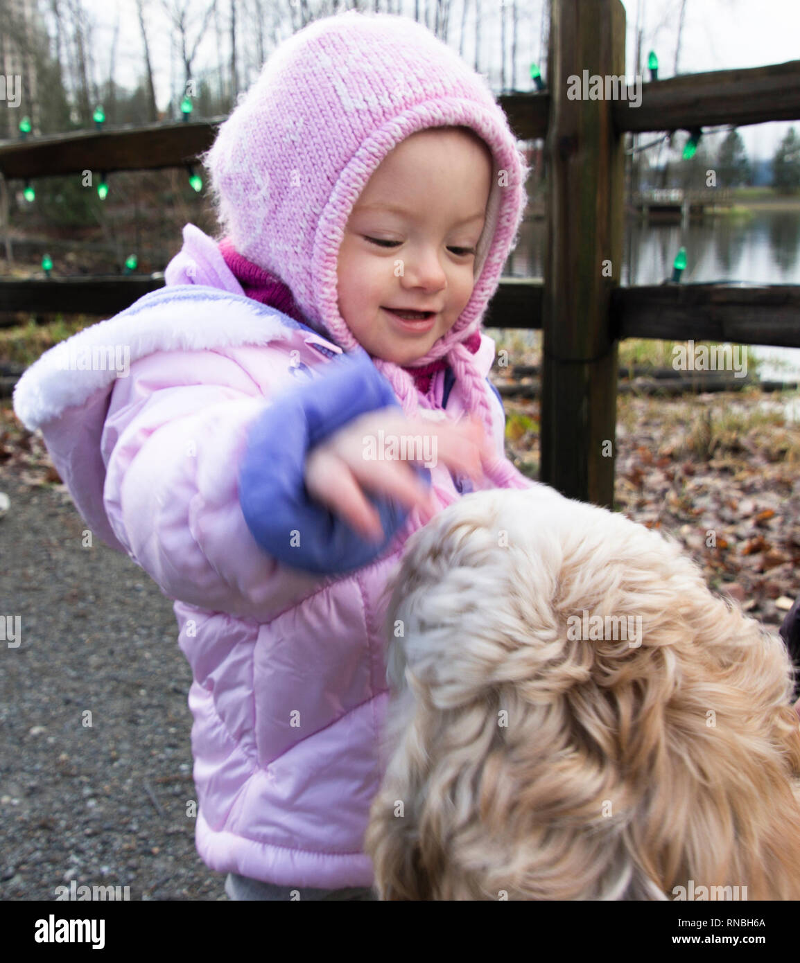 20 months old baby enjoying the nice weather outside. Toddler girl ...