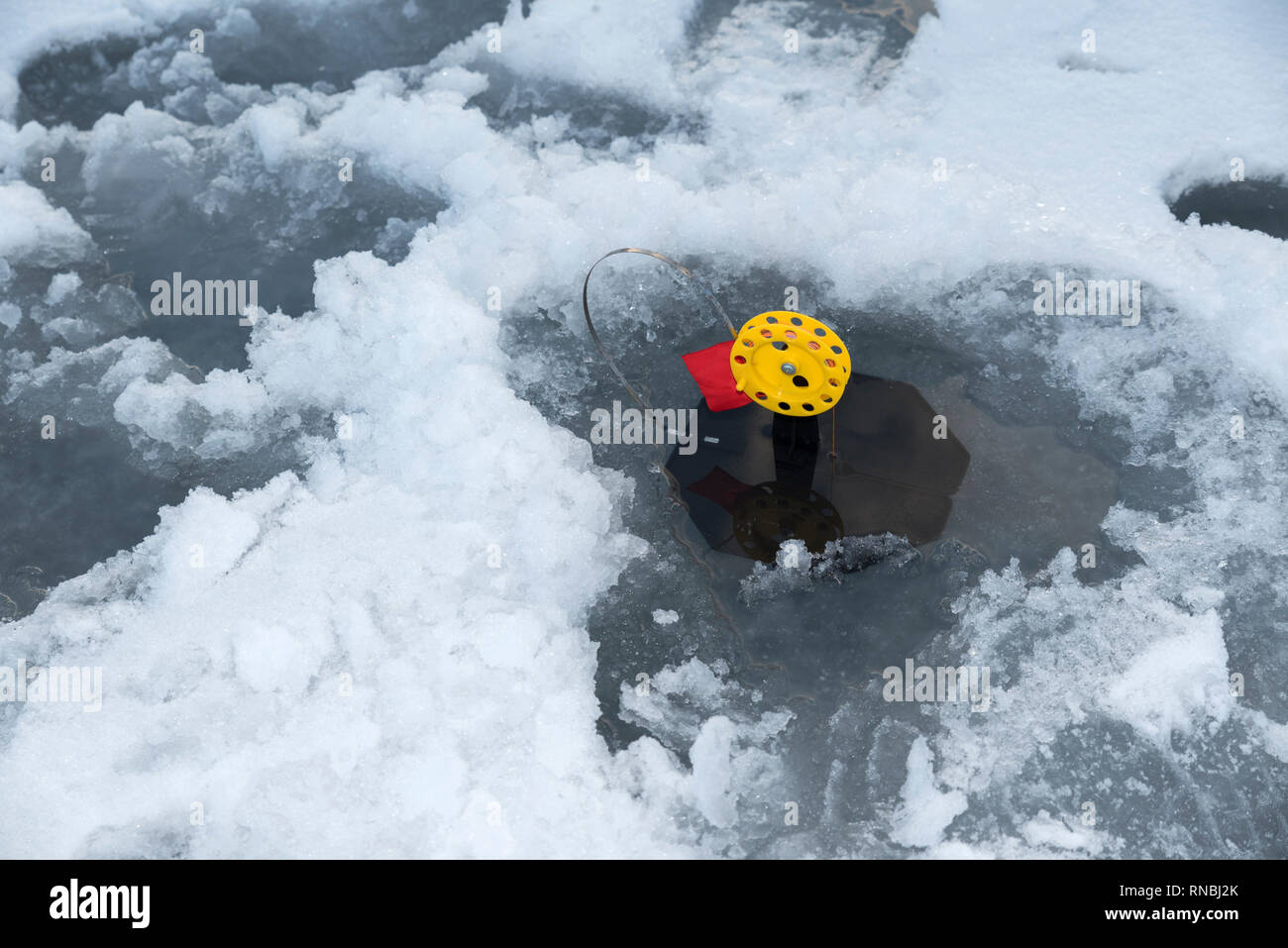 Winter fishing ice tackle for pike Selective focus Stock Photo - Alamy