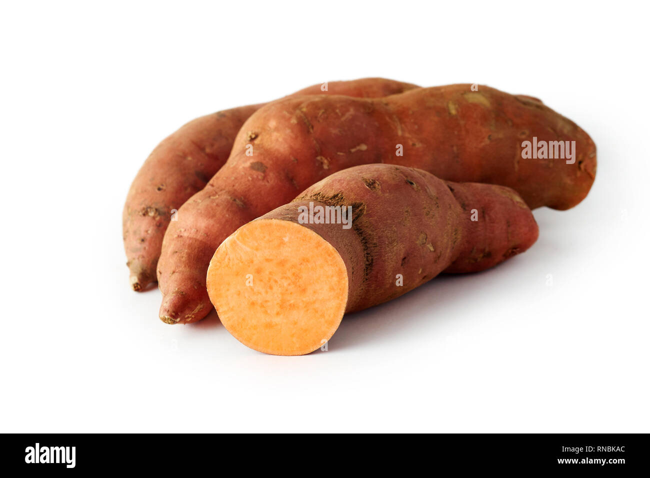 Organic orange sweet potato isolated on white background Stock Photo ...