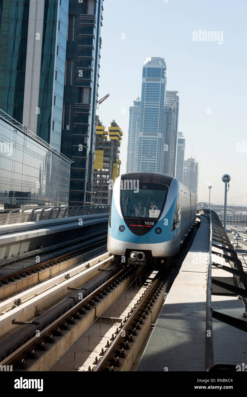 A driverless automatic Dubai Metro approaching Downtown Dubai in Dubai ...